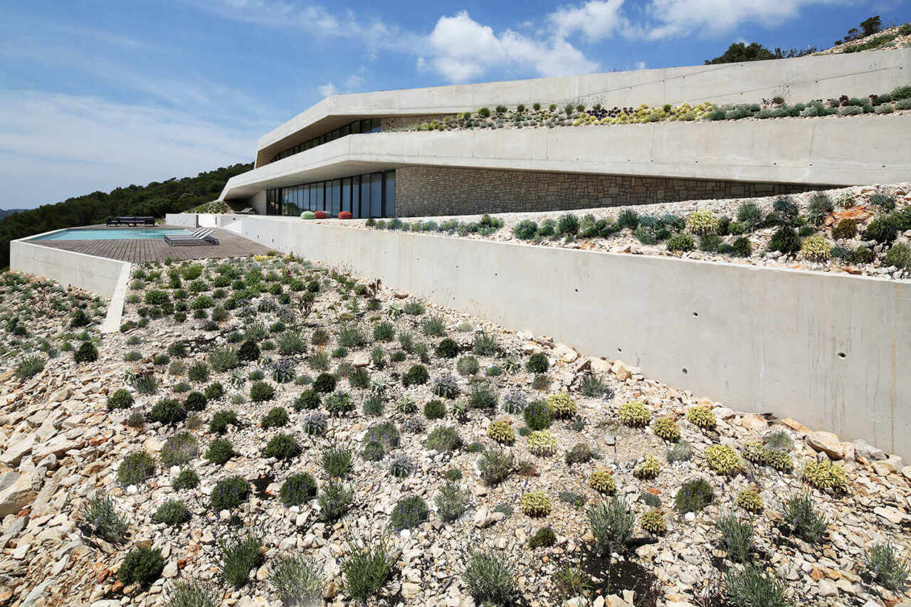 How Architects Built a Modern Family Home Into a Steep Island Hillside ...